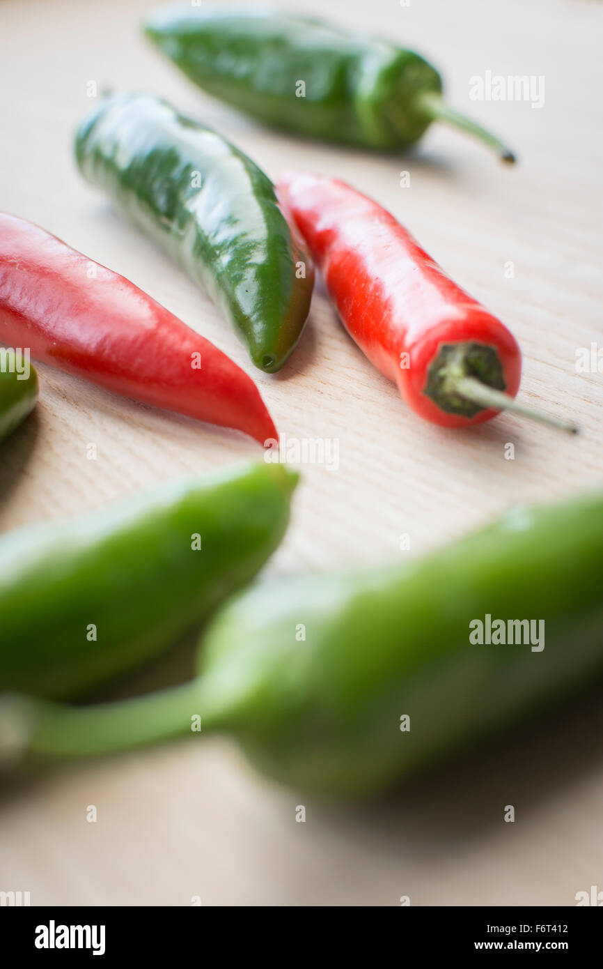 Red and Green fresh chilli pepper ingredients laid out ready for ...