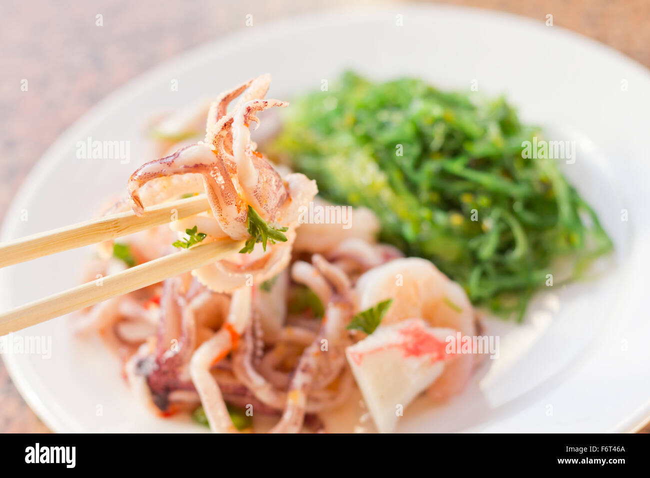 Lobster shrimp and calamari seafood salad with sesame seaweed Stock ...