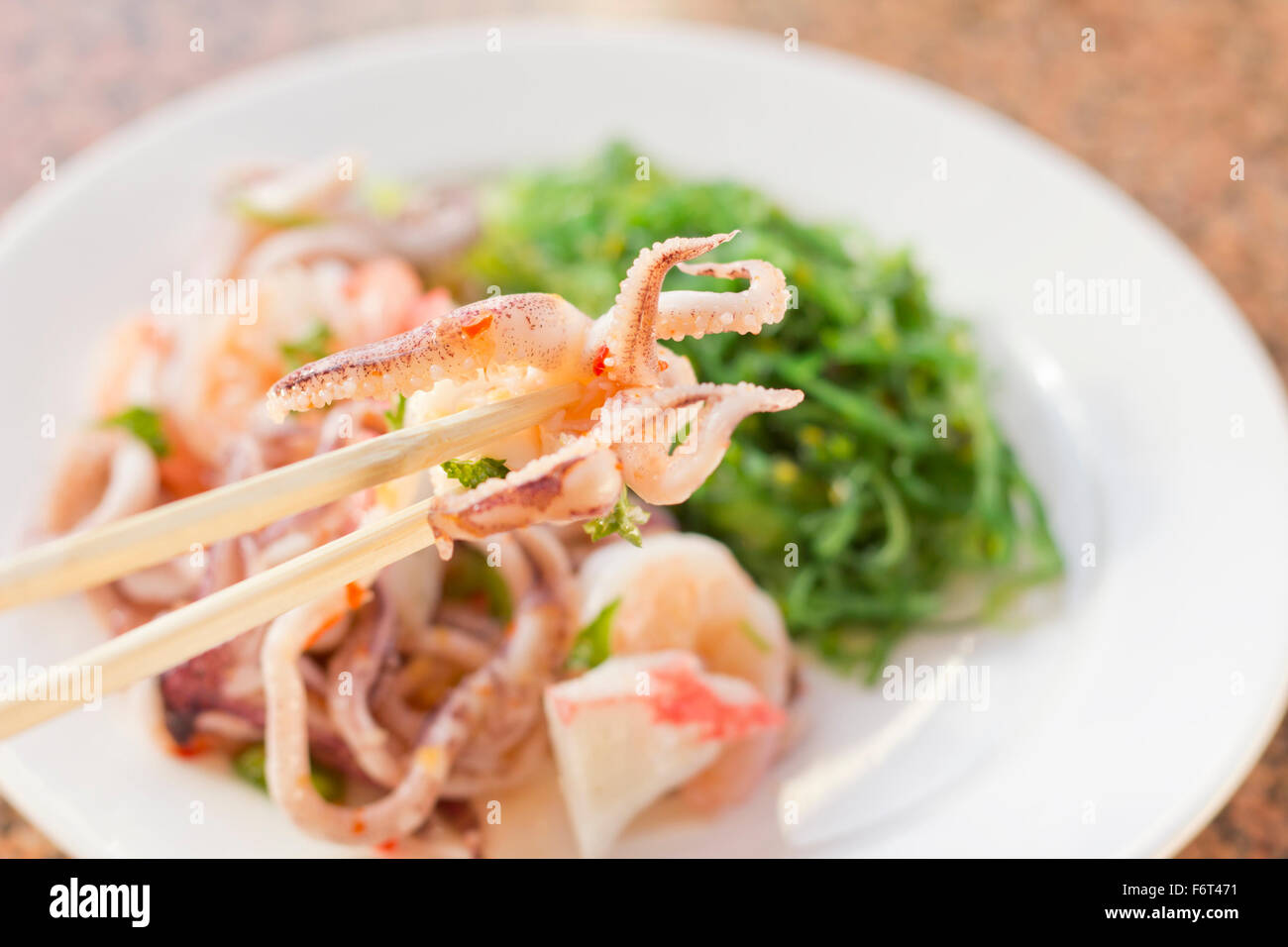 Lobster shrimp and calamari seafood salad with sesame seaweed Stock ...