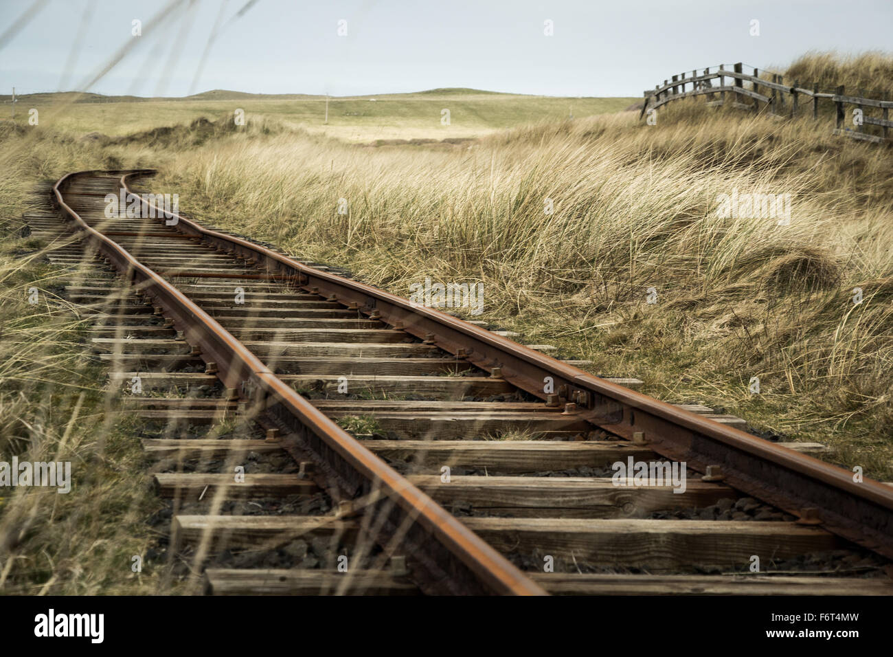Rusty train tracks in sand dunes between Bushmills/Portballintrae and ...