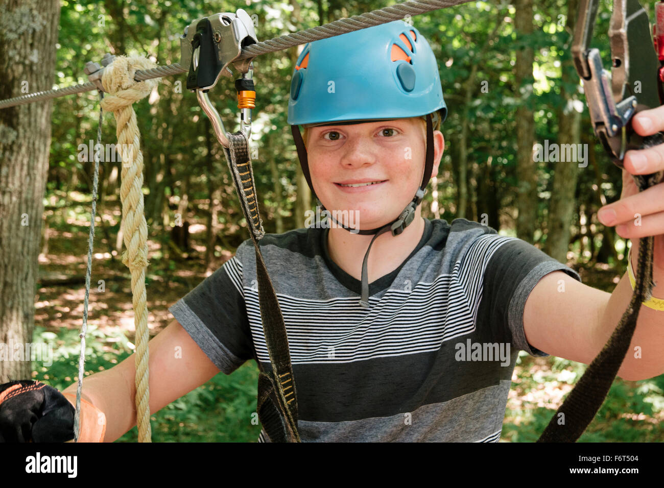 Caucasian teenage boy on zip Stock Photo - Alamy