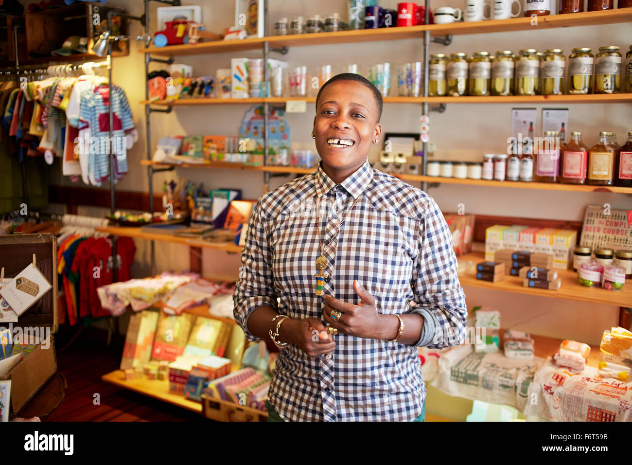 Woman smiling in store Stock Photo - Alamy