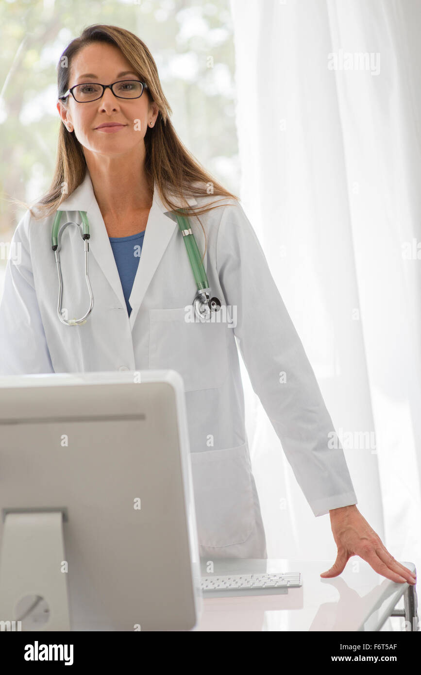 Caucasian doctor using computer Stock Photo - Alamy