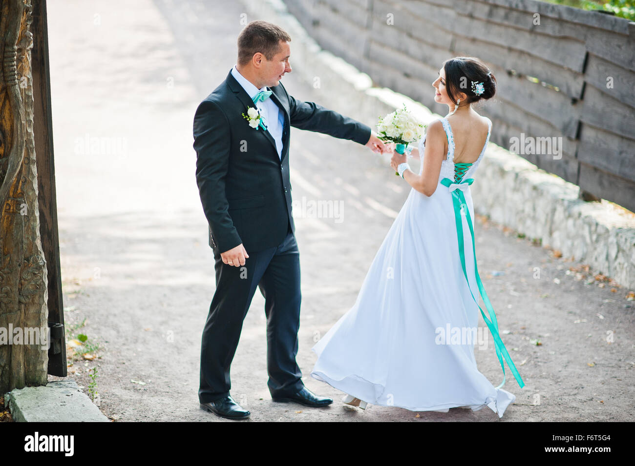 Newly wed in their wedding day at park Stock Photo - Alamy