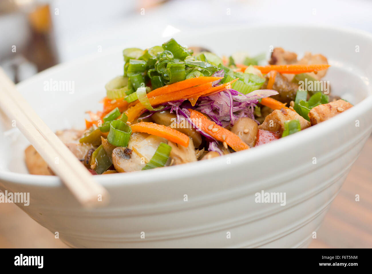 Korean Dak Bulgogi chicken rice bowl topped with fresh scallions Stock ...
