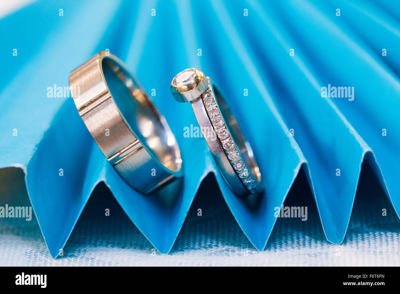 Bride and groom wedding rings photographed before the ceremony on a ...