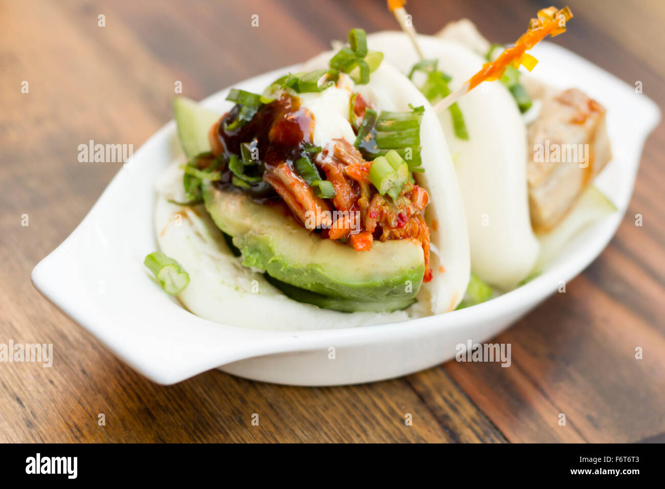 Korean steamed buns with pork belly avokado and kimchi Stock Photo - Alamy