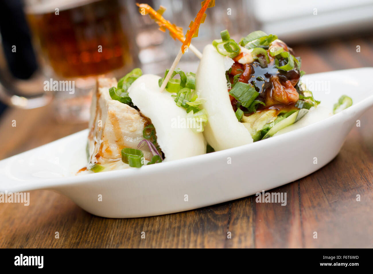 Korean steamed buns with pork belly avokado and kimchi Stock Photo - Alamy