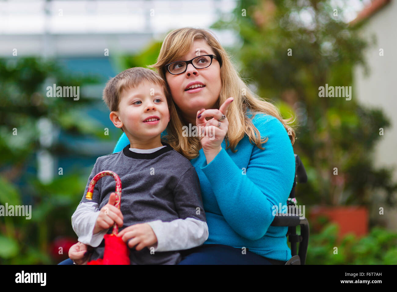 Paraplegic mother and son exploring outdoors Stock Photo - Alamy