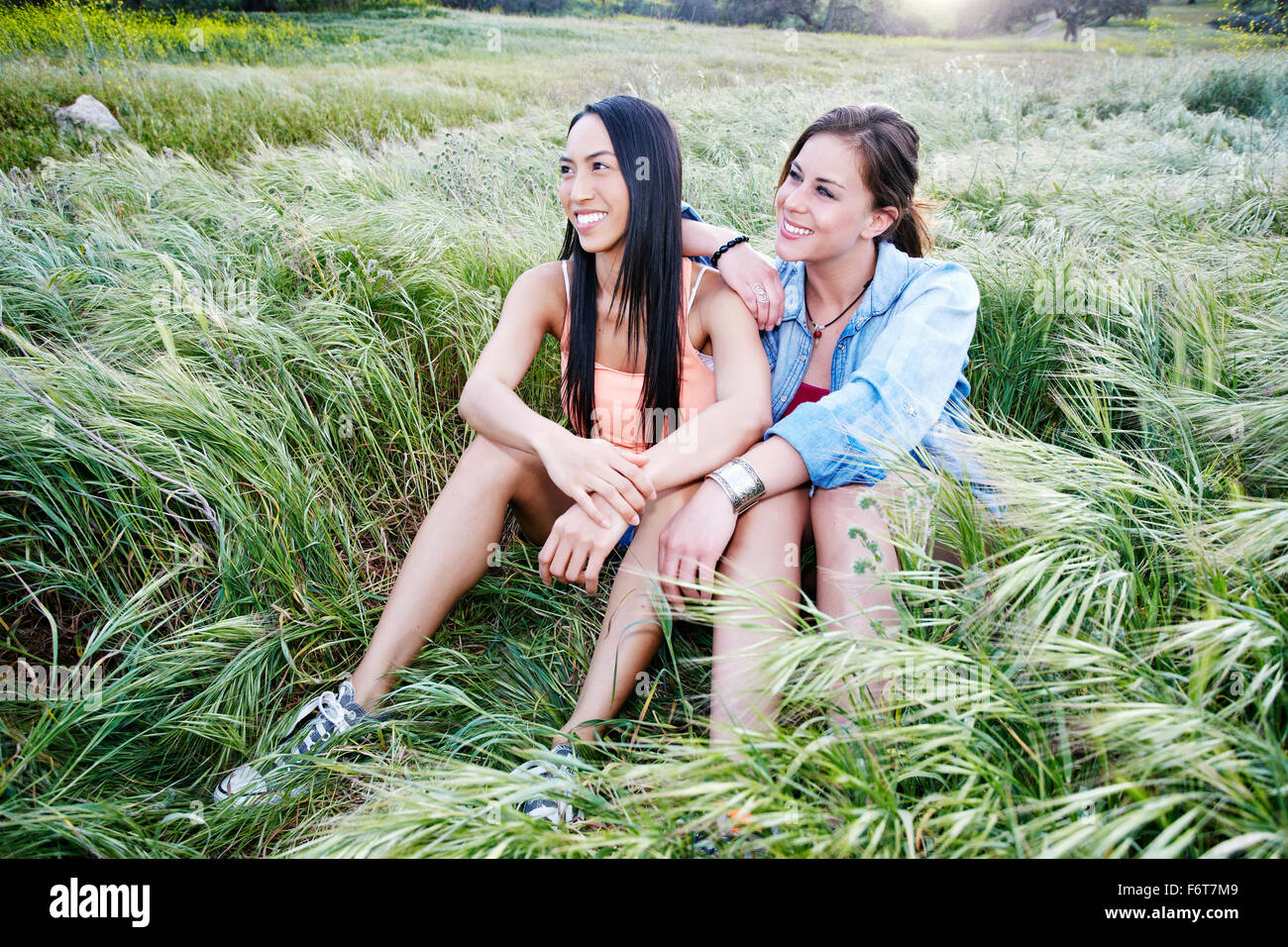 2 women sitting full body hi-res stock photography and images - Alamy