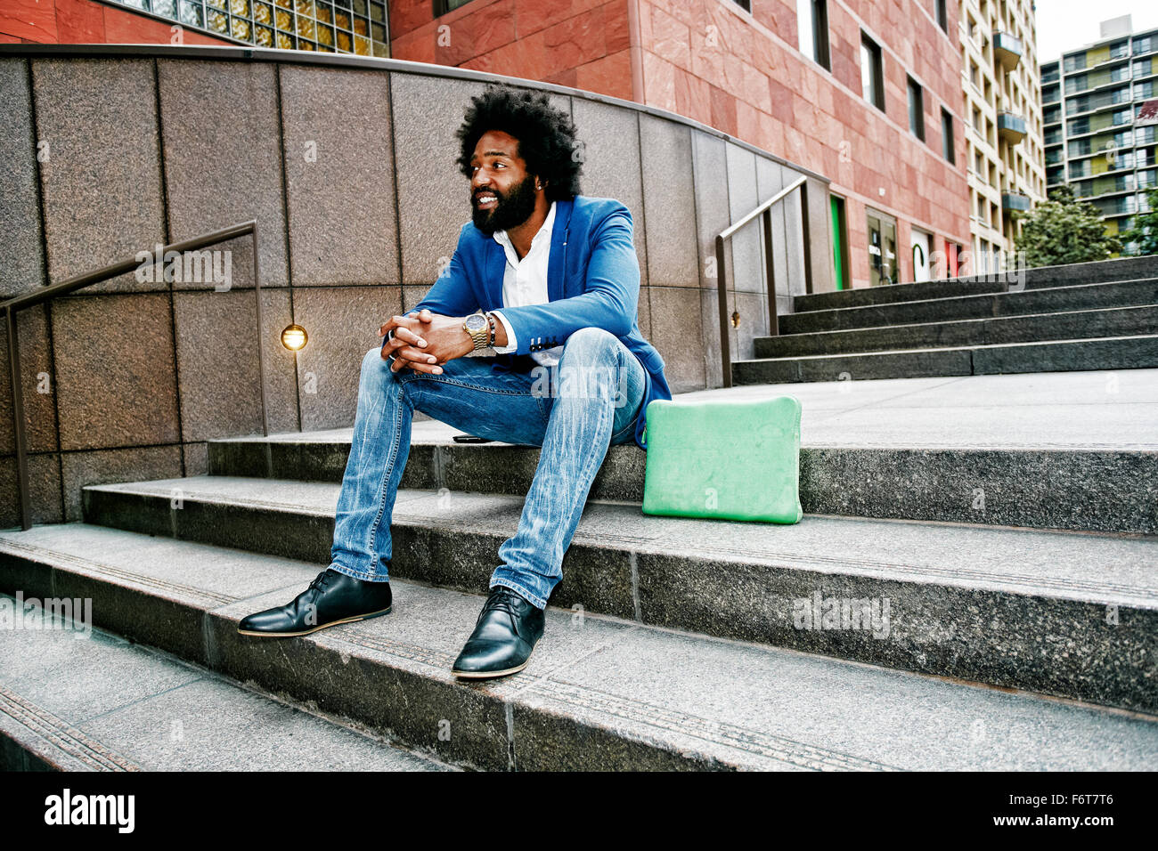 Black people sitting on step hi-res stock photography and images - Alamy