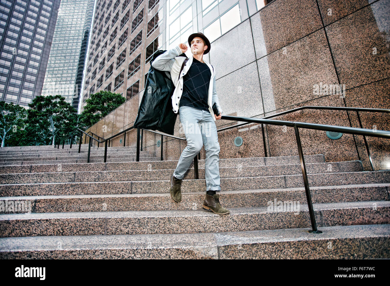 Caucasian businessman walking on steps Stock Photo - Alamy