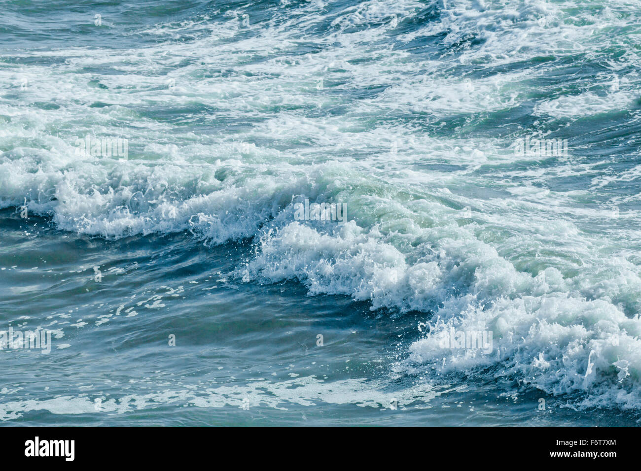 Colorful blue ocean waves in closeup tropical imagery Stock Photo - Alamy