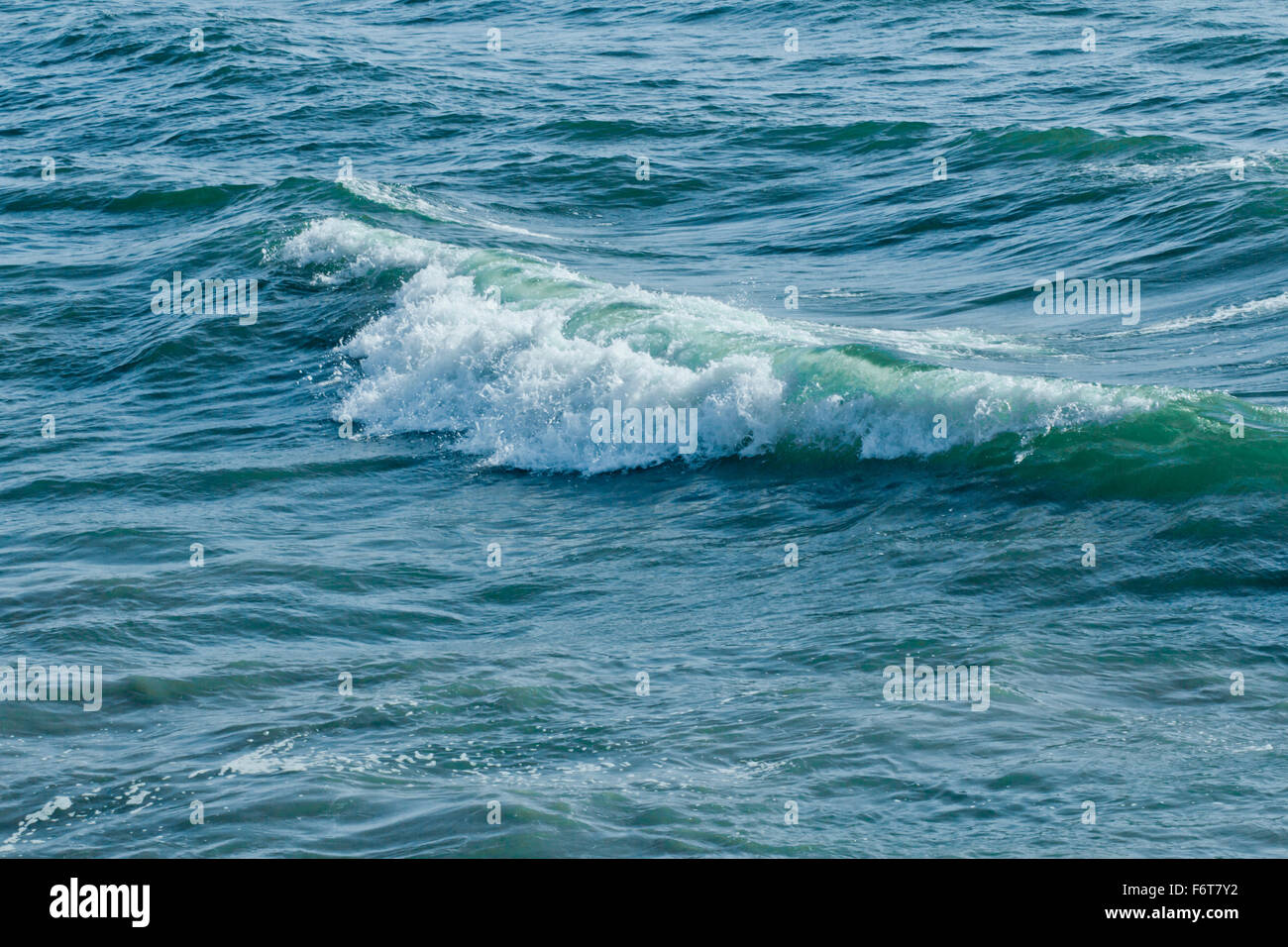 Colorful blue ocean waves in closeup tropical imagery Stock Photo - Alamy
