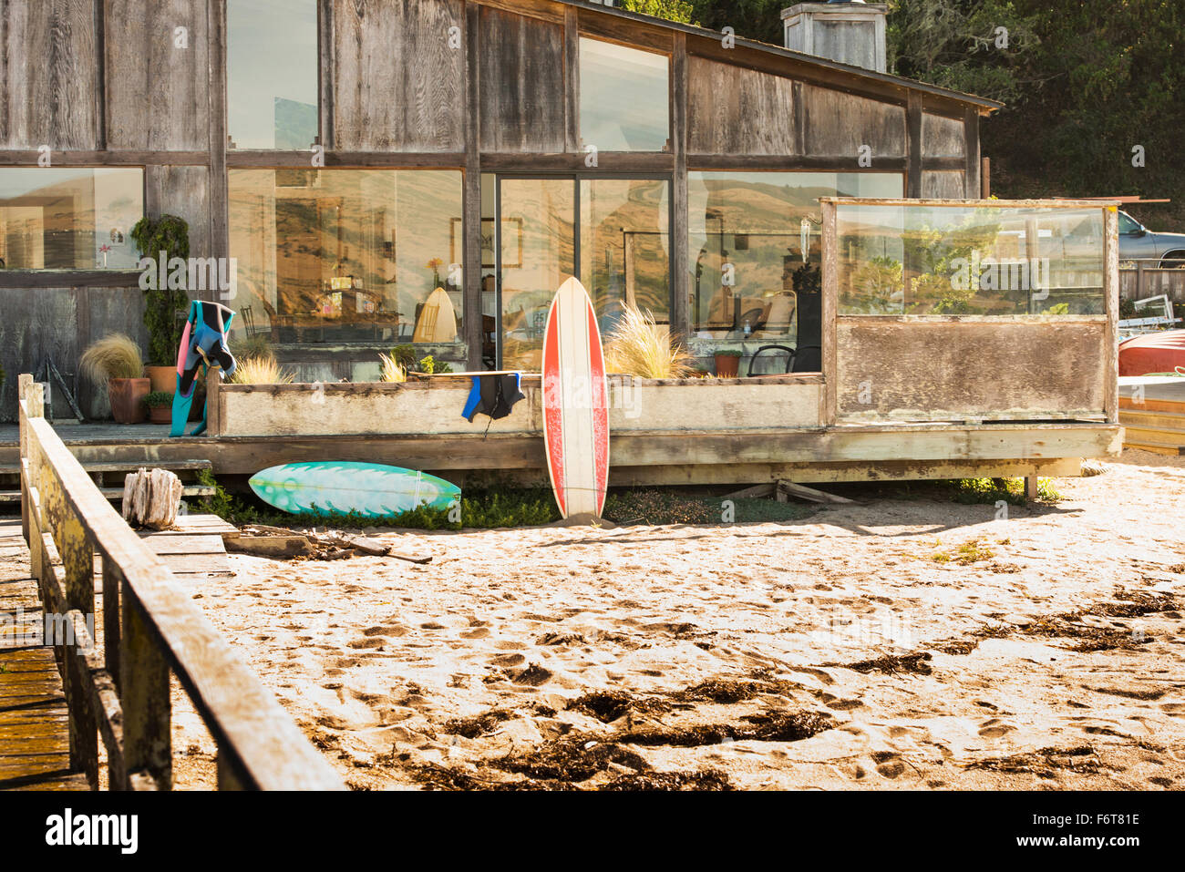 Surfboards in backyard of beach house Stock Photo - Alamy
