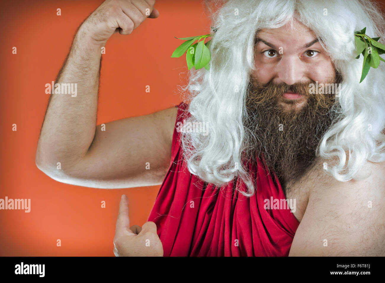 Strong zeus god or jupiter against orange background Stock Photo - Alamy