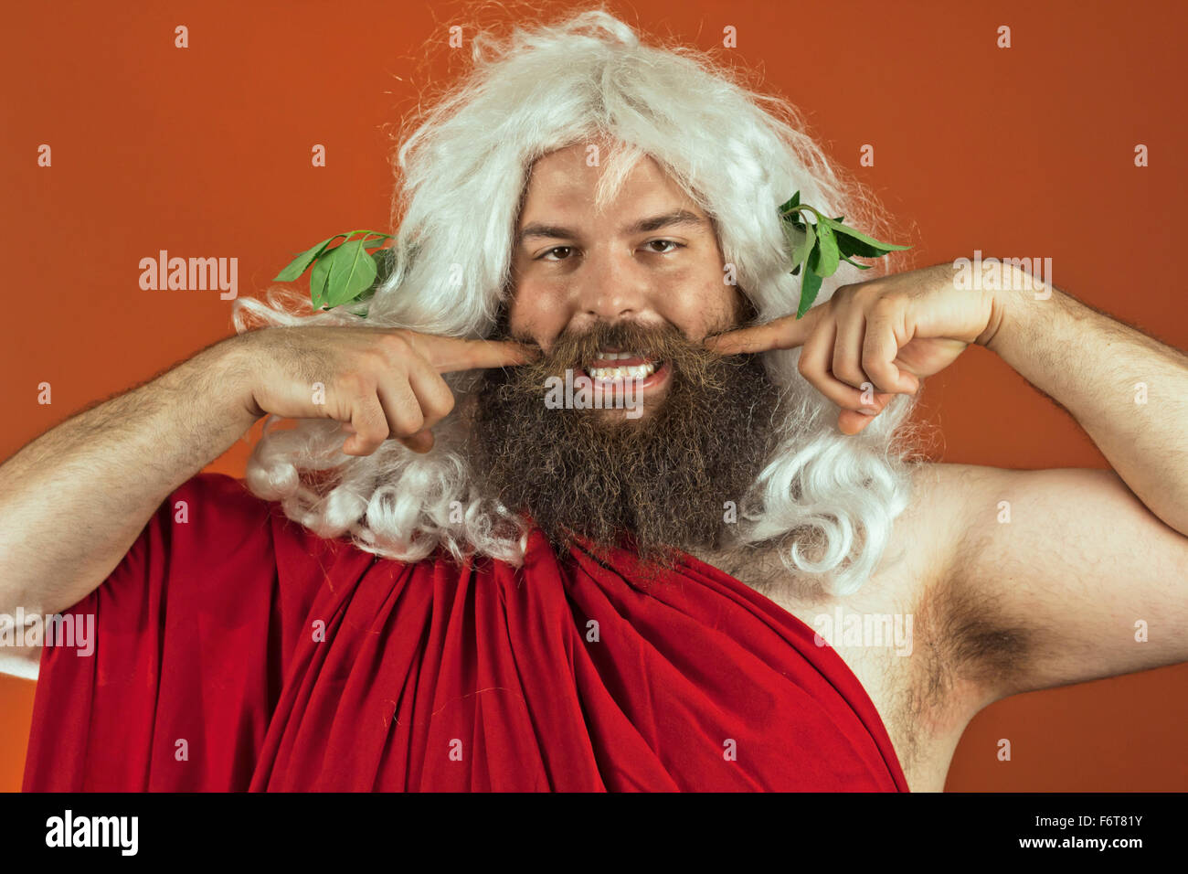 Weird zeus god or jupiter against orange background Stock Photo - Alamy