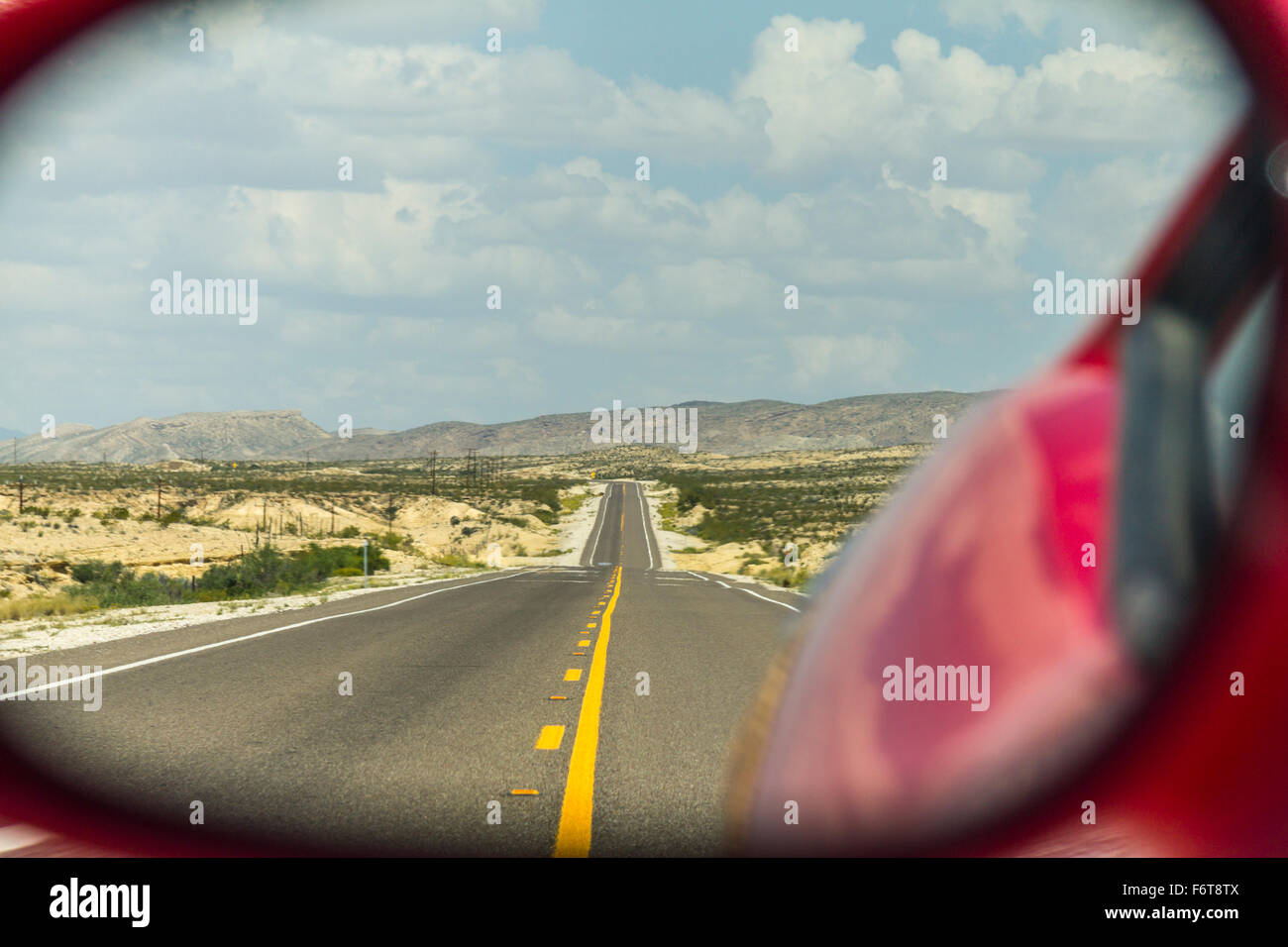 Highway through rear mirror Stock Photo - Alamy
