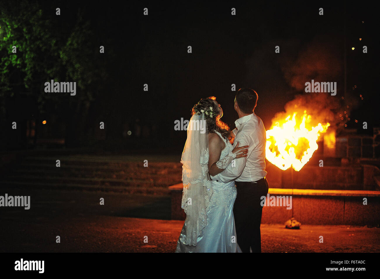 wedding couple background two fire heart Stock Photo - Alamy