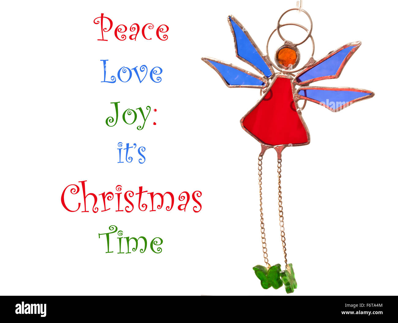 A home made Christmas glass ornament, a stylised angel swinging in the ...