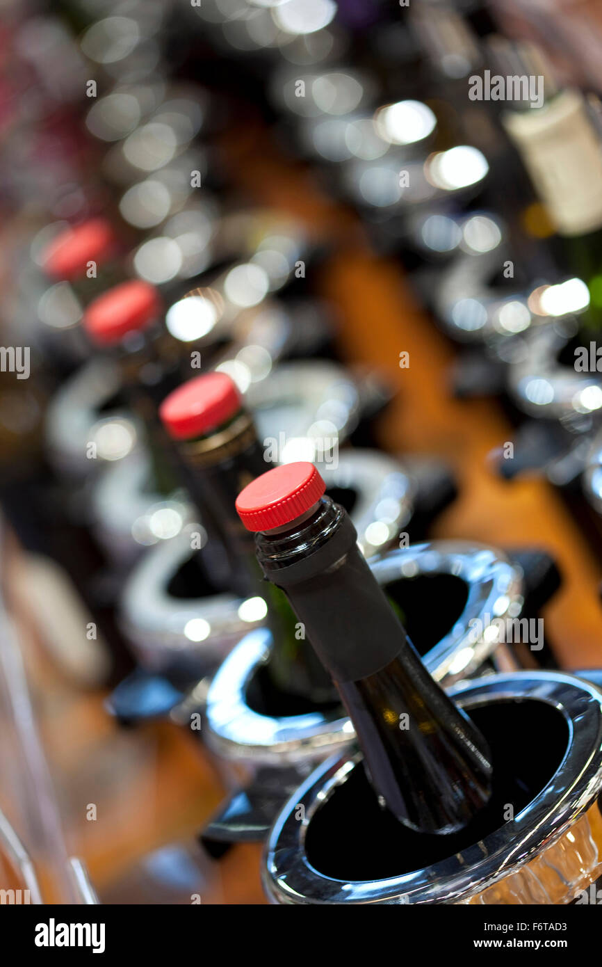 Bottles of red wine and buckets in a winery Stock Photo - Alamy