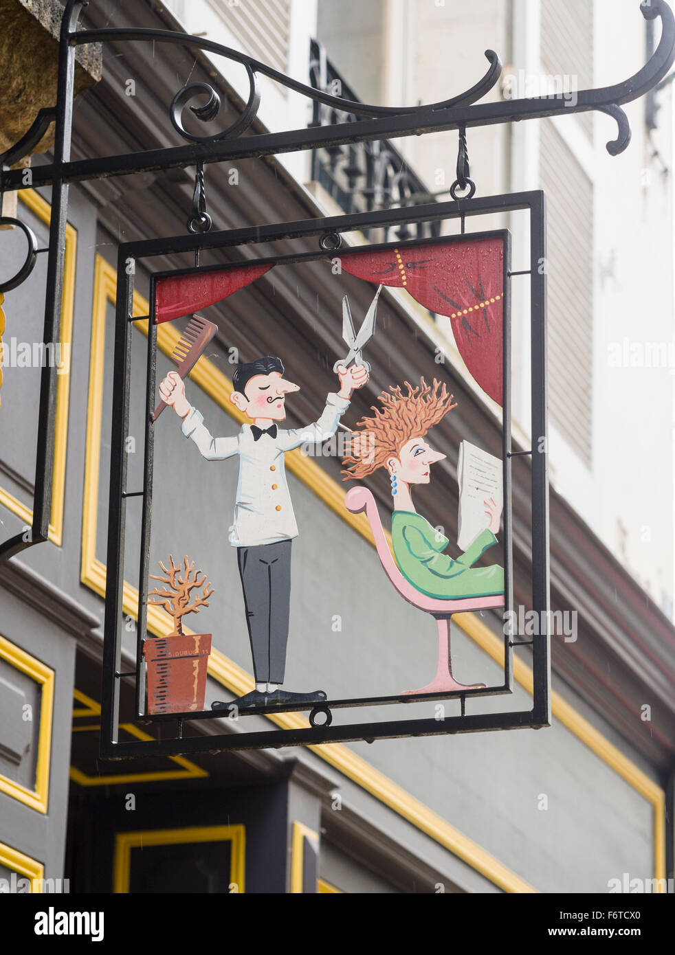 A sign for a Hair Dresser's shop in Loches. A sign depicting a hair ...
