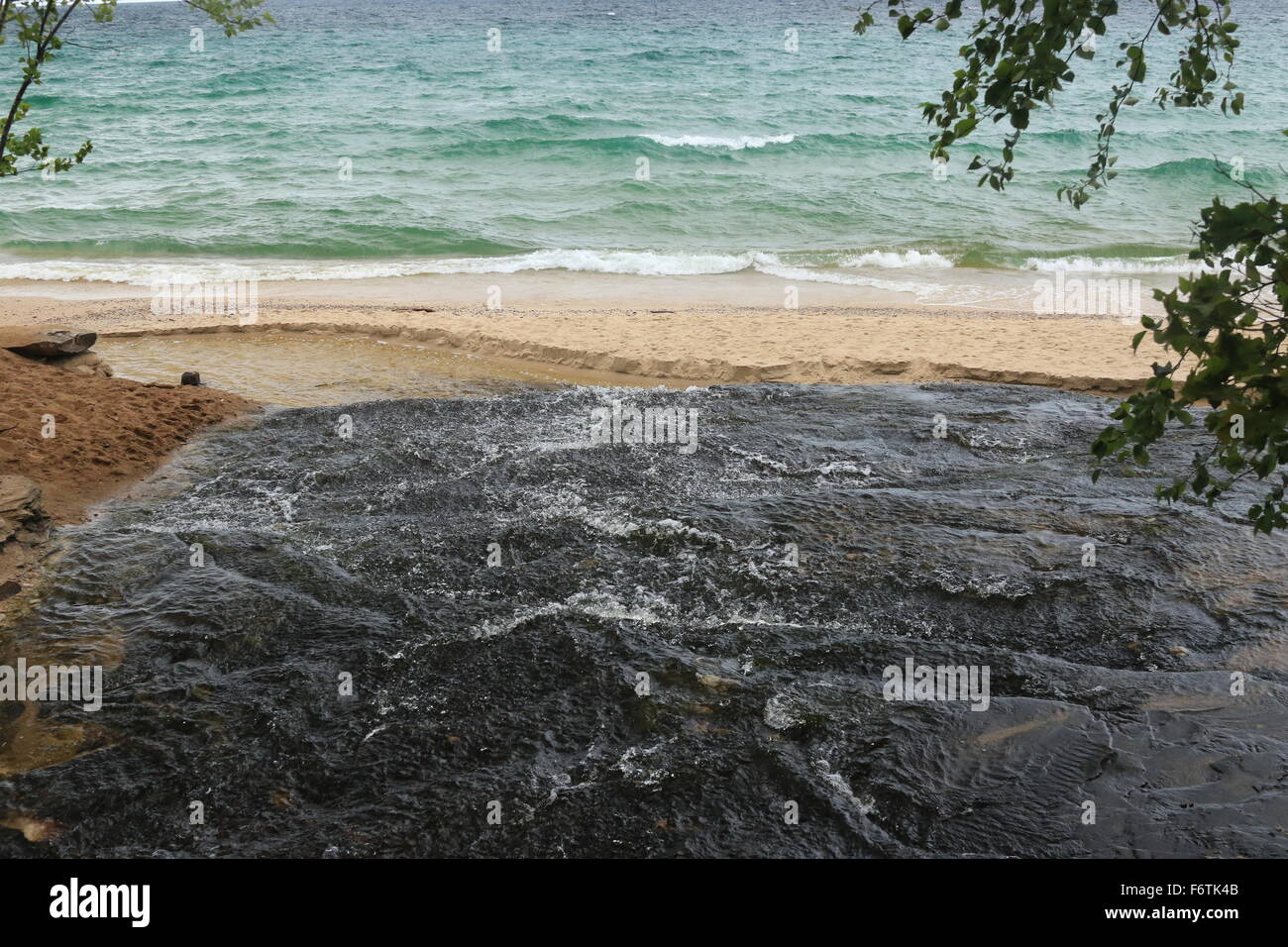 Waterfall on Chapel Beach running into Lake Superior in the Pictured ...