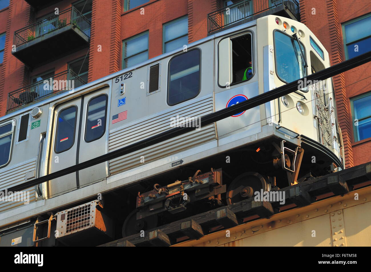A CTA Green Line rapid transit train passes atop the Lake Street Bridge ...