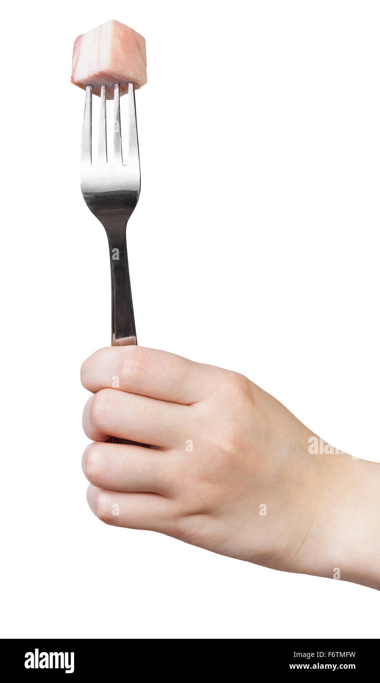 dinning fork with impaled piece of lard in hand isolated on white ...