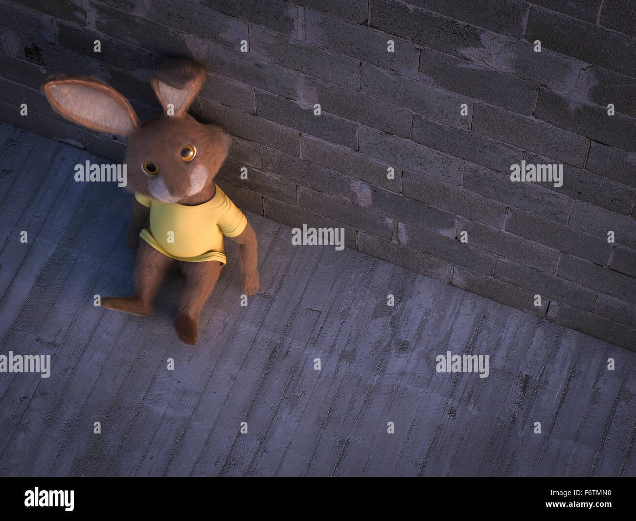 Abandoned bunny sitting alone in backyard Stock Photo - Alamy