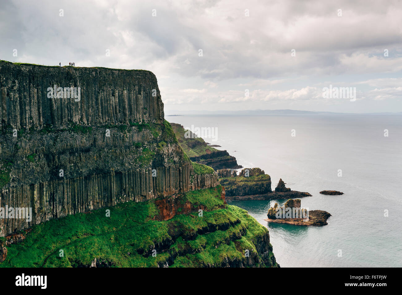 UK, Northern Ireland, County Antrim, basalt and sandstone cliffs at ...