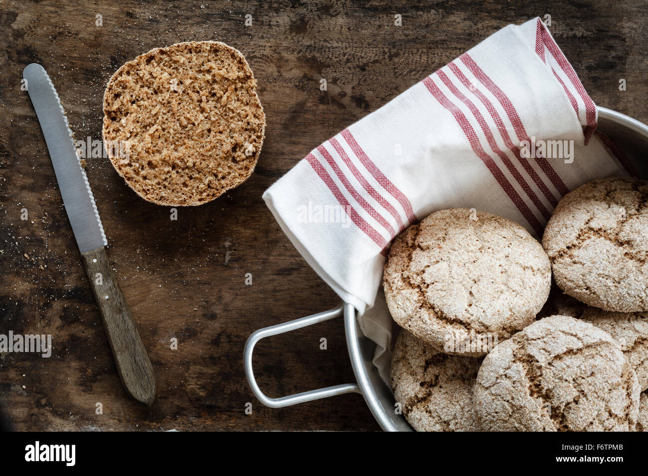 Homemade rye bread rolls in bowl, on chopping board Stock Photo - Alamy