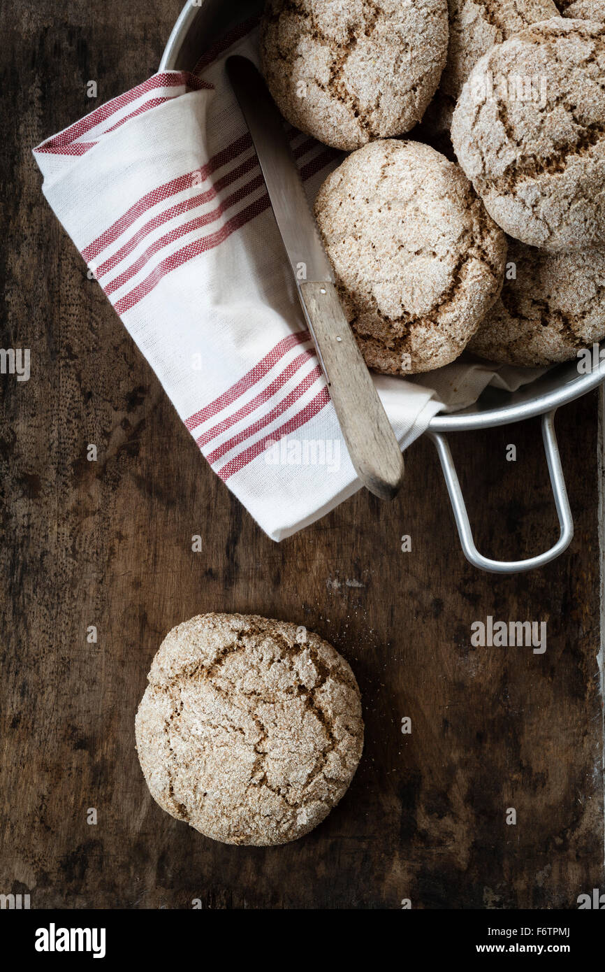 Homemade rye bread rolls in bowl, on chopping board Stock Photo - Alamy
