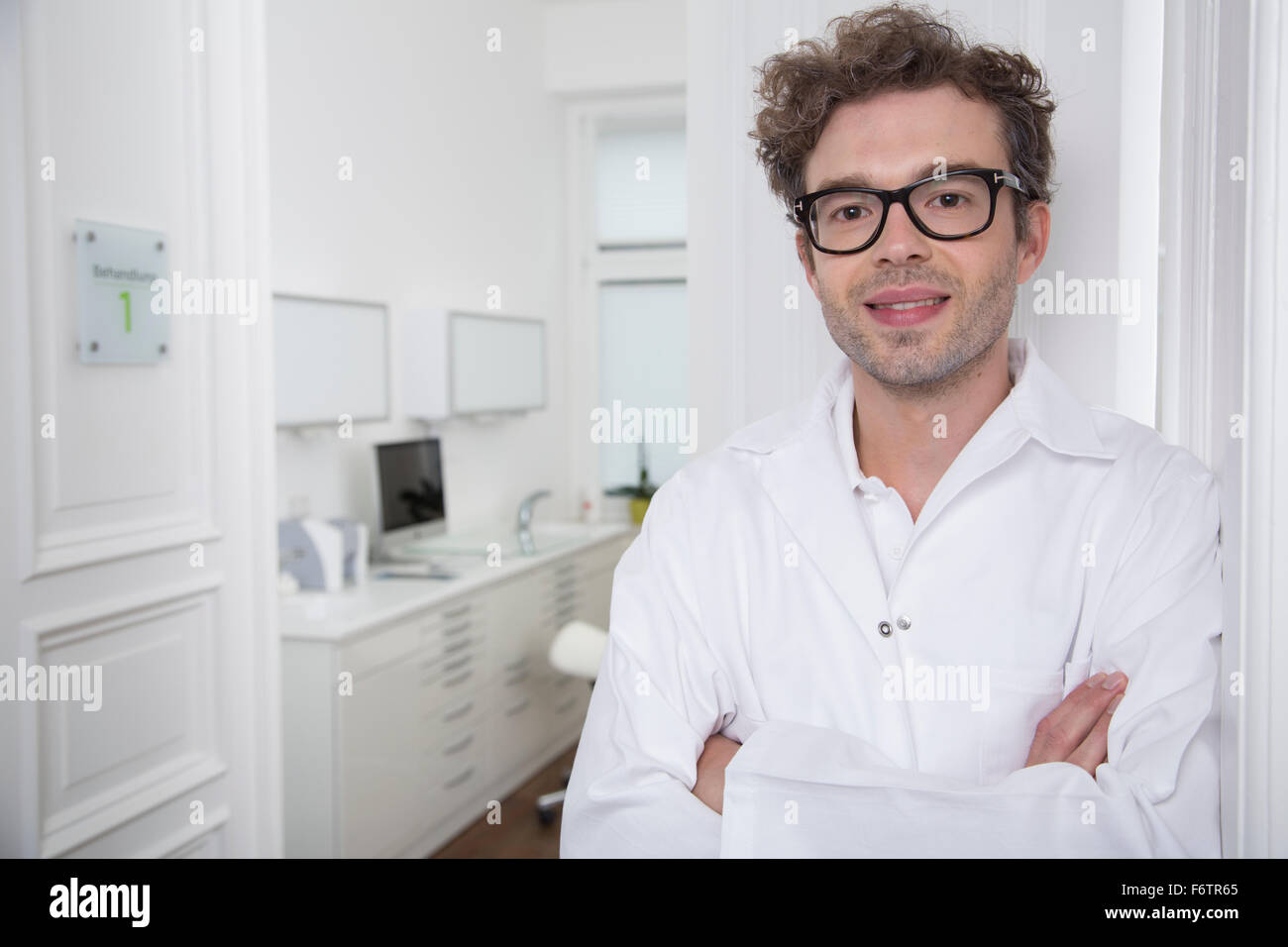 Portrait of smiling doctor at medical practice Stock Photo - Alamy