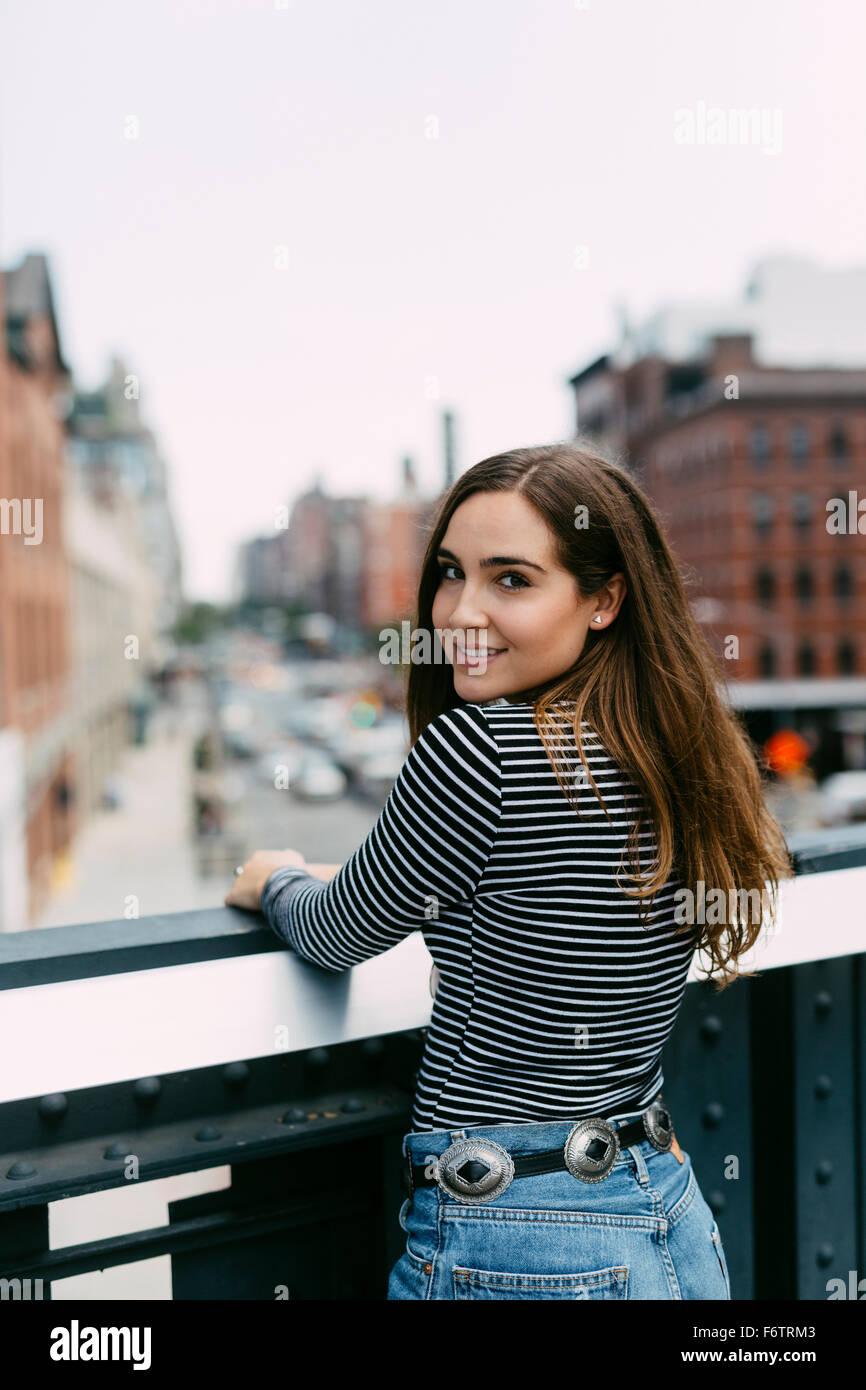 USA, New York City, portrait of smiling brunette young woman Stock ...
