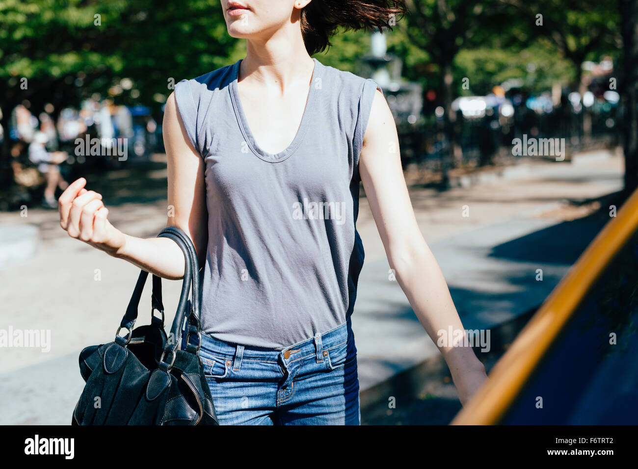 USA, New York City, young woman catching a yellow cab Stock Photo - Alamy