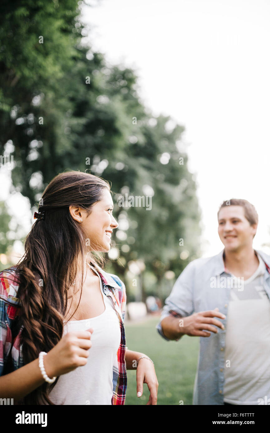Young couple in love in a park Stock Photo - Alamy