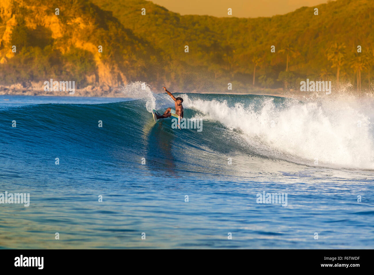 Indonesia, Lombok, surfing man Stock Photo - Alamy