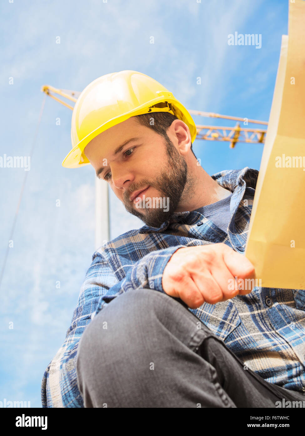 Portrait of foreman with construction plan Stock Photo - Alamy