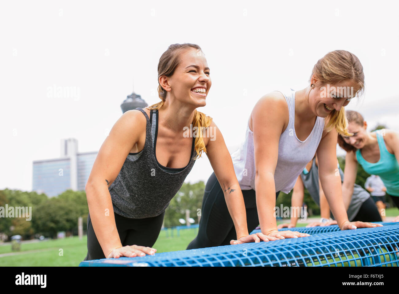Four women having an outdoor workout Stock Photo - Alamy