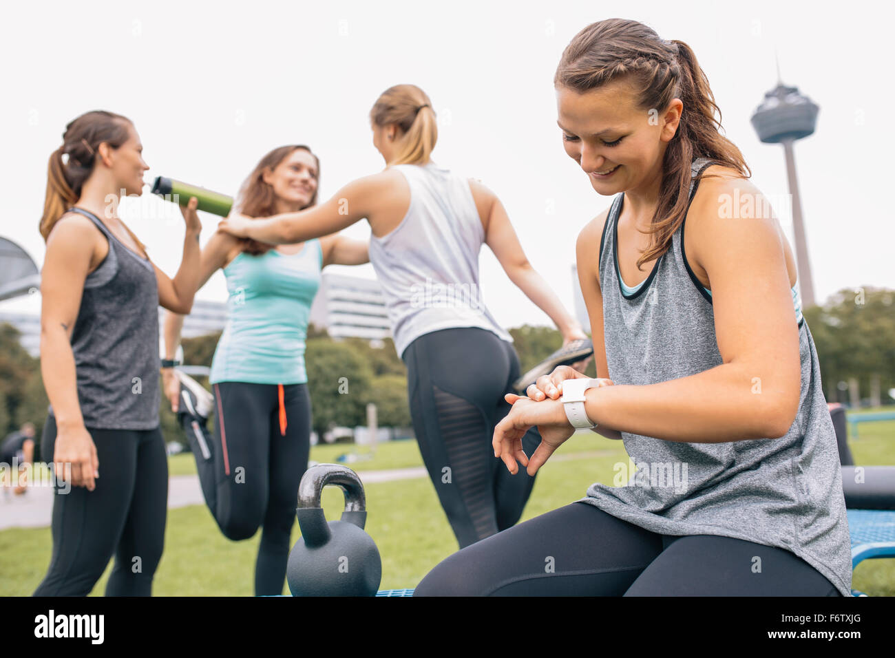 Four women relaxing after workout Stock Photo - Alamy