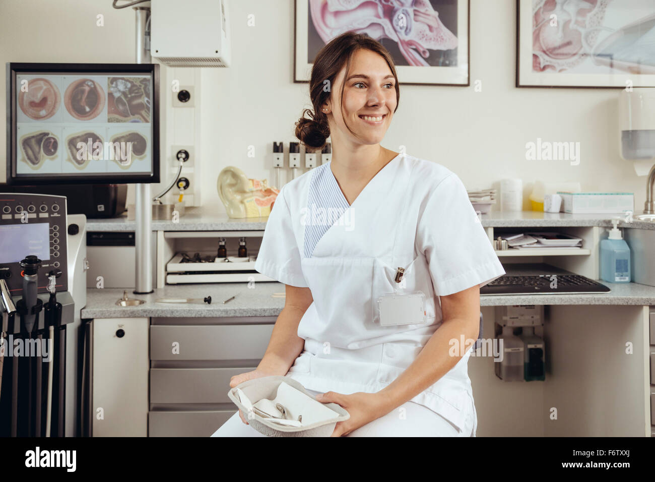 Nurse with medical instrumnets sitting in ENT practice Stock Photo - Alamy