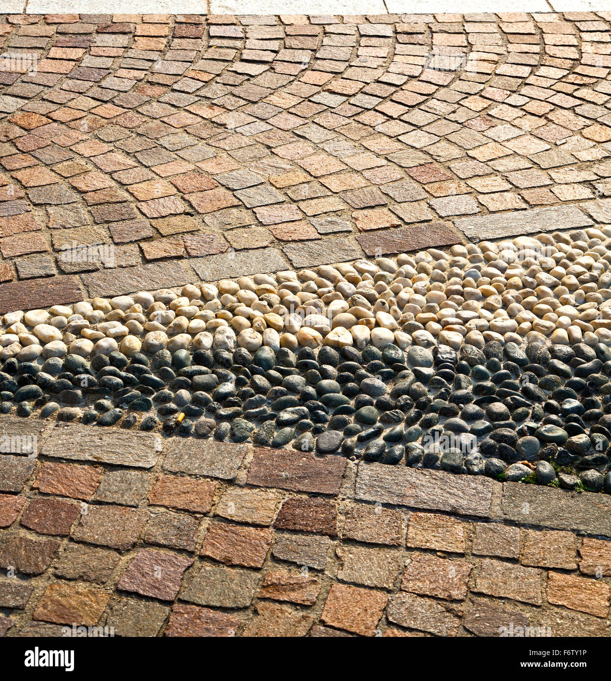 in mozzate street lombardy italy varese abstract pavement of a curch ...