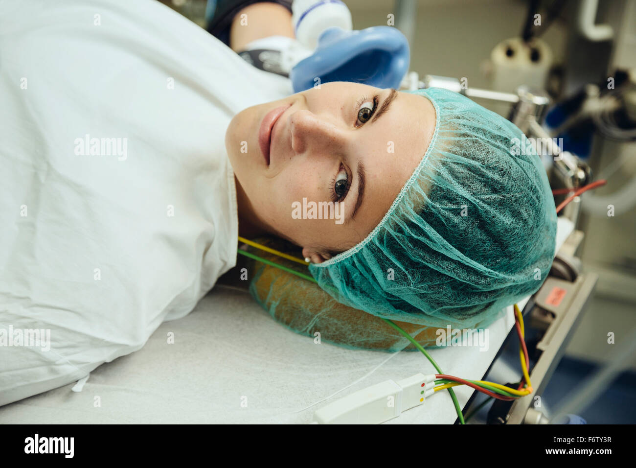 Woman lying on operating table hi-res stock photography and images - Alamy