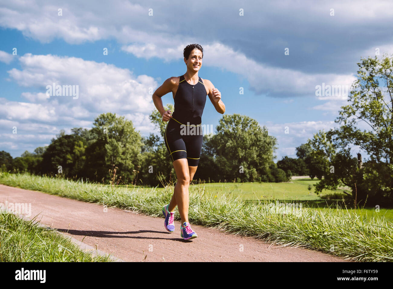 Female triathlete running hi-res stock photography and images - Alamy