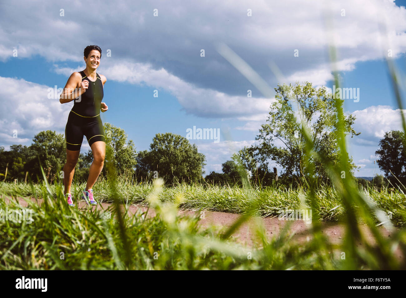 Female triathlete running hi-res stock photography and images - Alamy