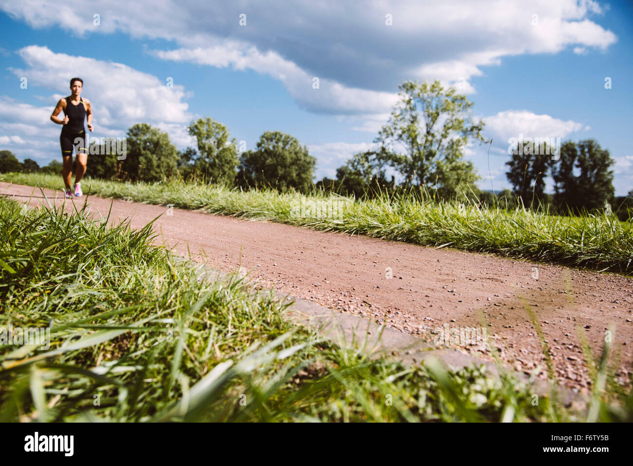 Female triathlete running hi-res stock photography and images - Alamy