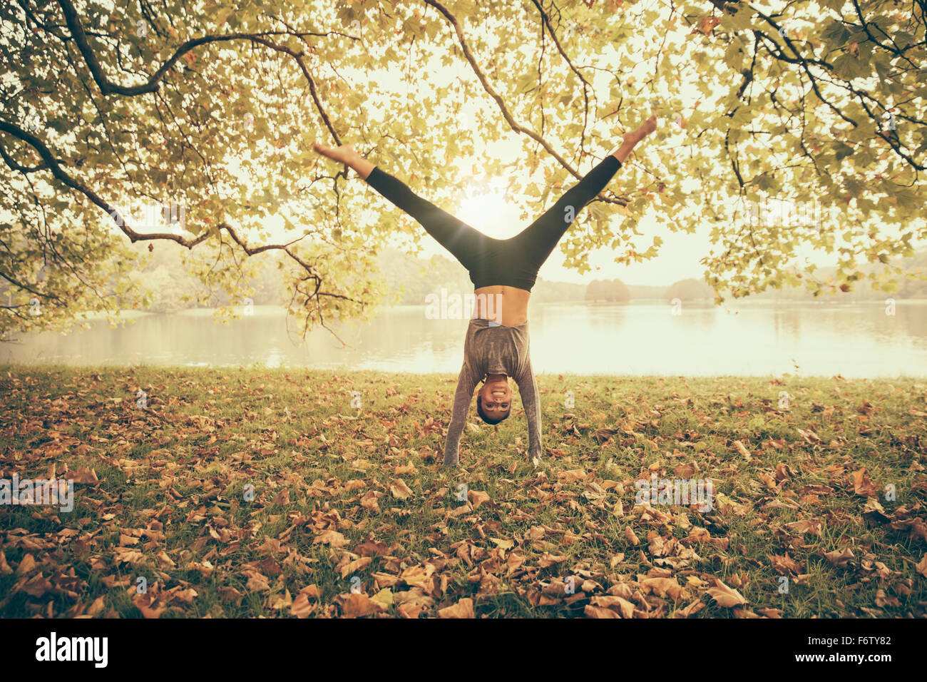 Woman turning cartwheel hi-res stock photography and images - Alamy