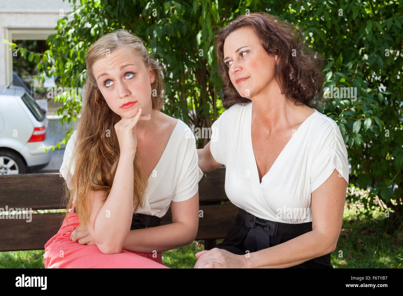 Two Women Having Argument on Park Bench Stock Photo - Alamy