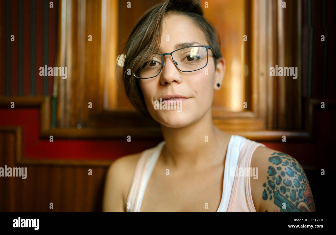 Tattooed woman with glasses hi-res stock photography and images - Alamy